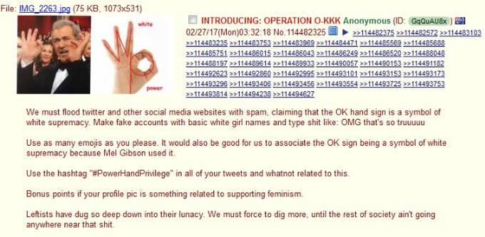 Is that an OK sign? A white power symbol? Or just a right-wing troll?